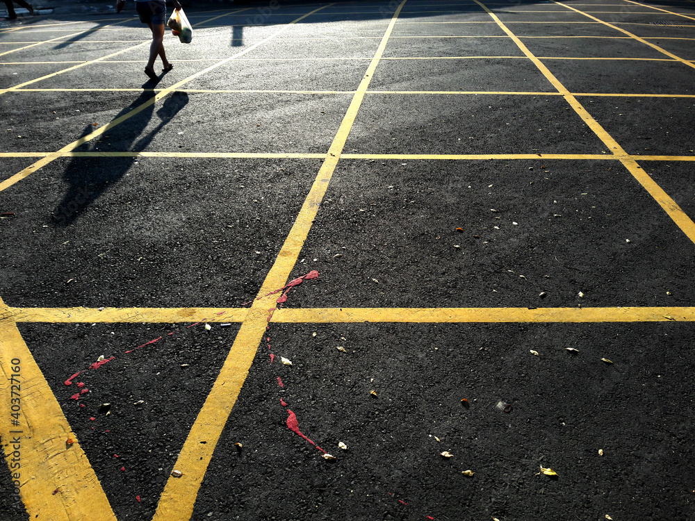 Checkered yellow line (yellow grid line) on old asphalt road texture ...