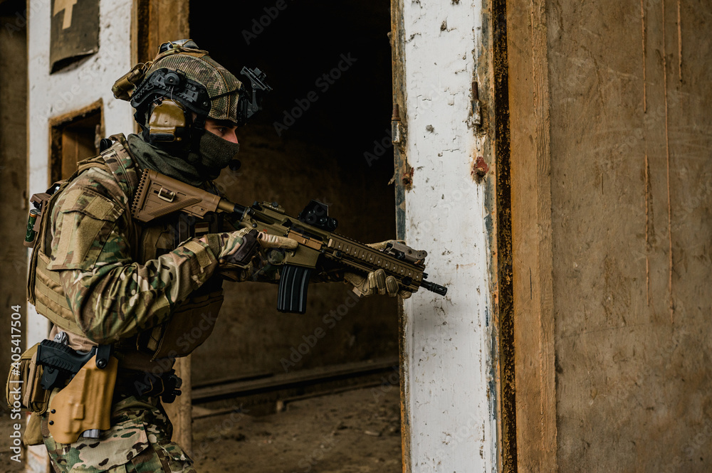 Special forces soldier doing tactical training in building clearing ...