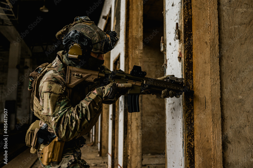 Special forces soldier doing tactical training in building clearing ...