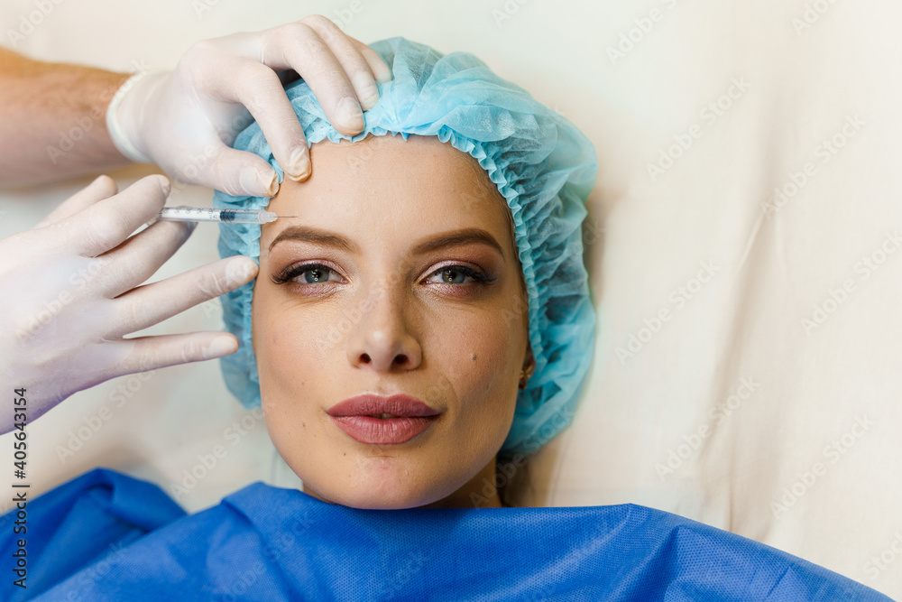 Injection in forehead contour plastic for correcting the volume and ...