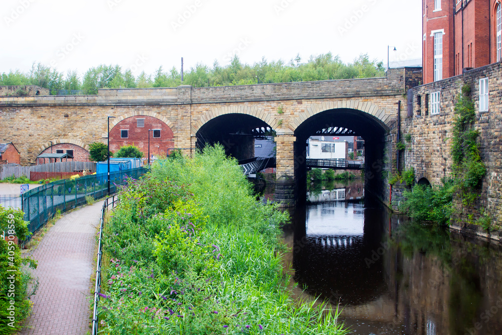 7 July 2020 A view of Cobweb Bridge over the River Don that runs ...