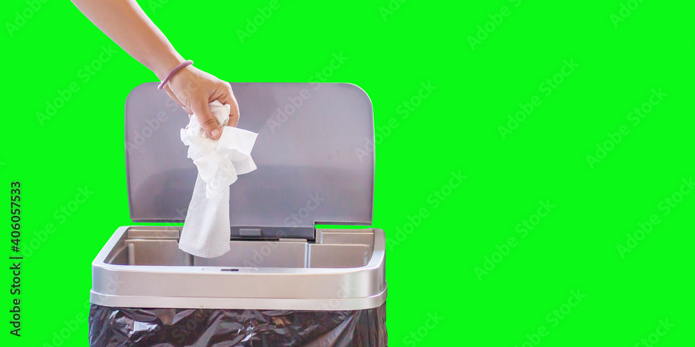 Woman hand throwing a white used crumpled tissue paper handkerchief ...