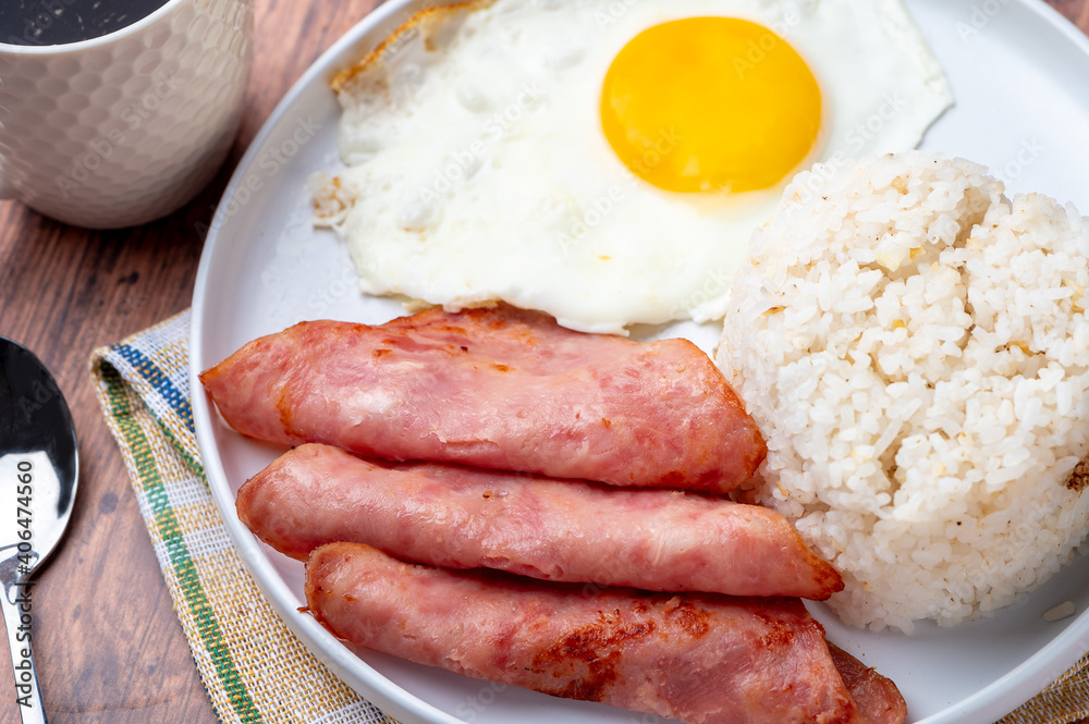 Hamsilog (close up)- famous Filipino meal that consists of fried rice, egg and ham slices. Stock ...