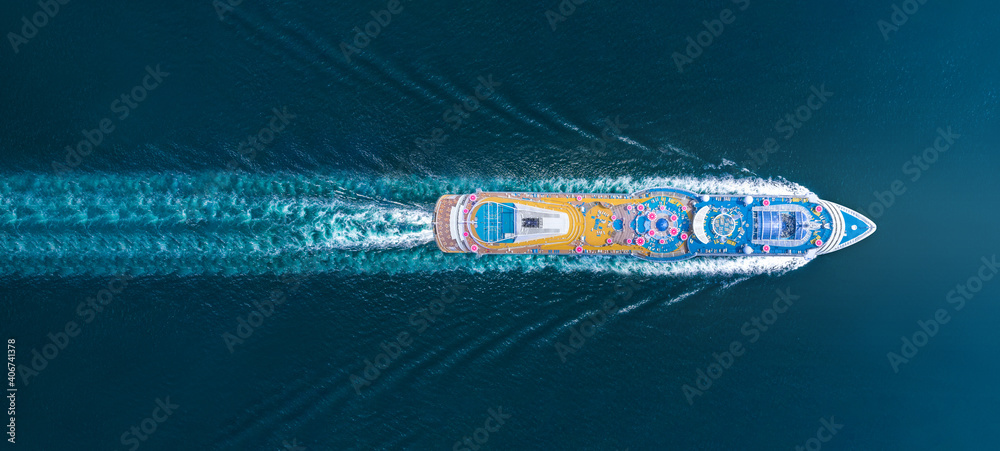 Aerial top view of beautiful white cruise running with contrail in the ...