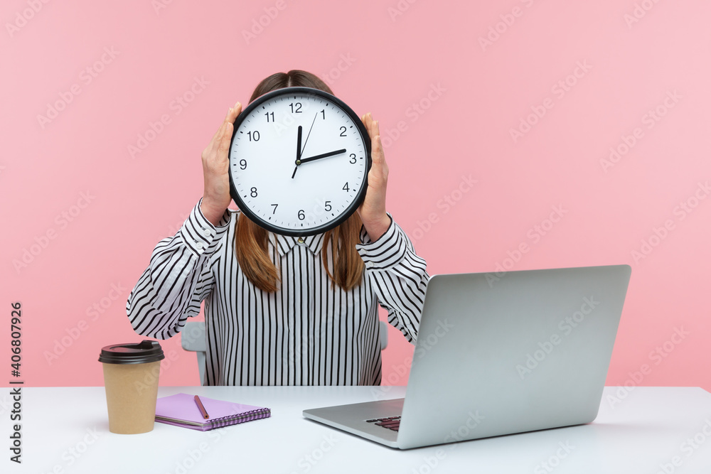 Time to work! Woman office worker sitting at workplace hiding face ...