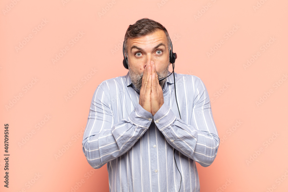 adult handsome man feeling worried, upset and scared, covering mouth ...