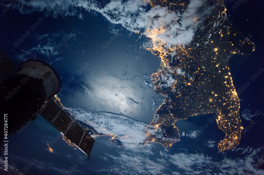 Stock-Foto „Night side of the Earth with city lights. South Italy and ...