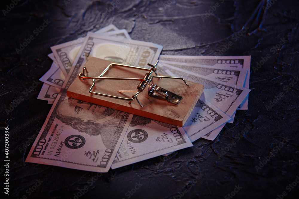 Mousetrap with free bait and dollar bills on a grey background. Trap ...