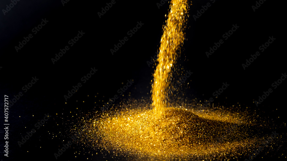 Sprinkle gold dust on a black background with copy space. Stock Photo ...