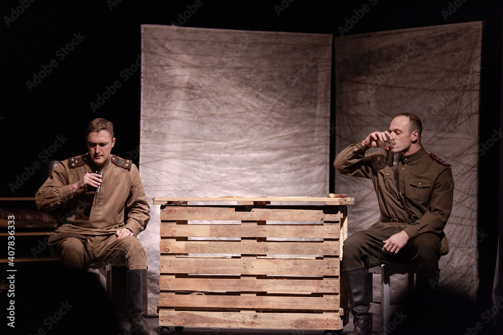 Actors in military uniforms of the Soviet army of World War II play a ...
