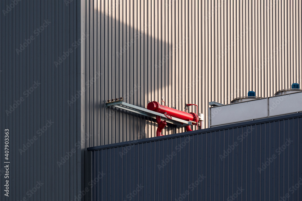 Low angle view of red chiller with compressors of air conditioners ...