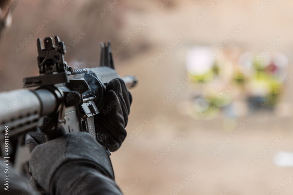 Person shooting a semi-automatic AR-15 assault weapon rifle at an ...