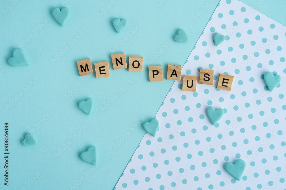 Concept. The inscription from the letters menopause. Symptoms of ...