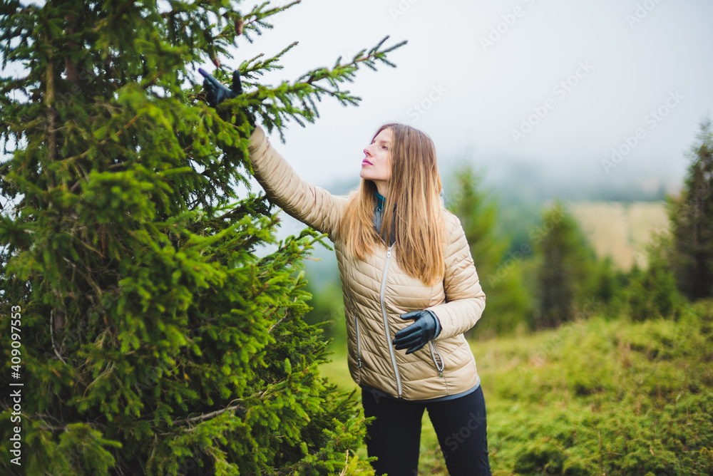 Blonde Girl by the Pine Tree Stock Photo | Adobe Stock