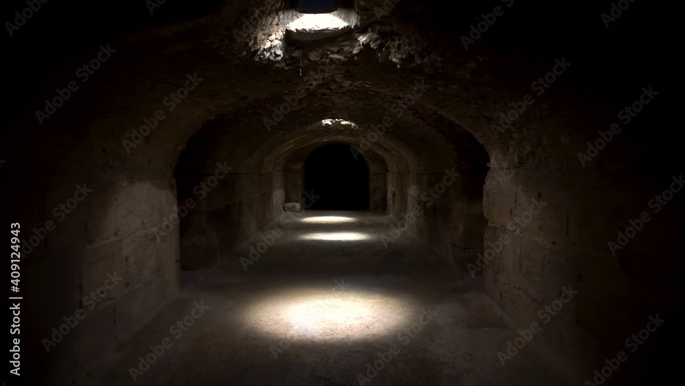 Passage through a dark roman basement. Basement under the Amphitheater ...