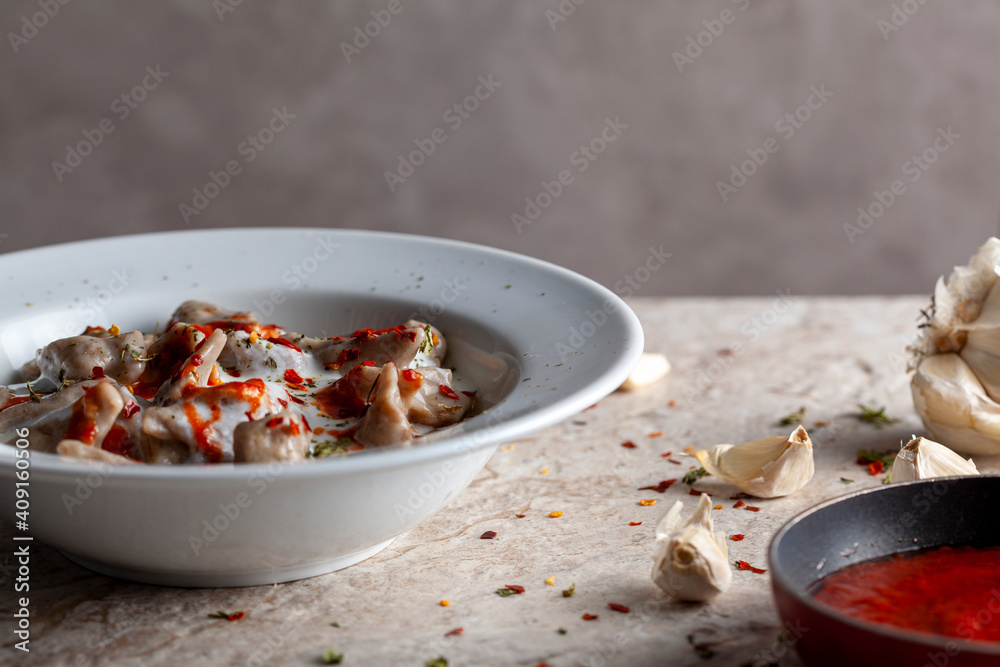 Traditional Turkish manti is a form of dumpling made with ground meat ...