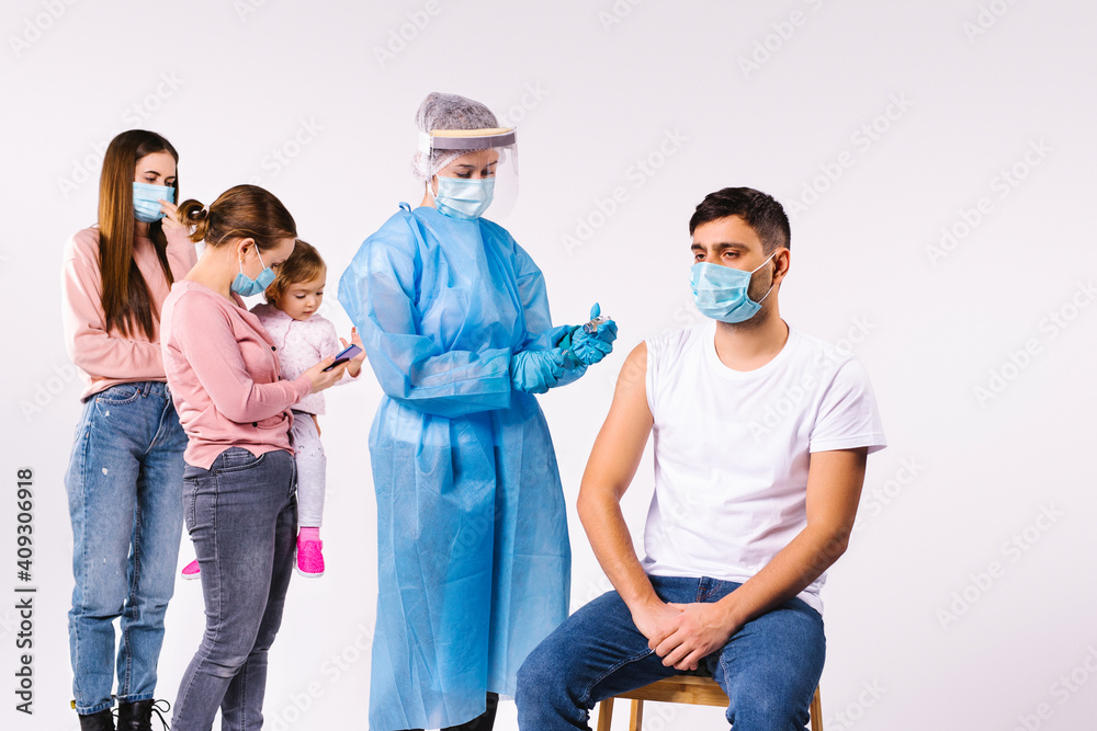 Vaccination of the population. Children and adults in line. The doctor ...