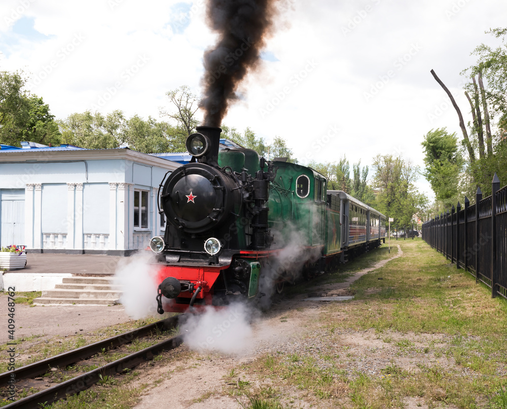 Narrow-gauge steam locomotive Stock Photo | Adobe Stock