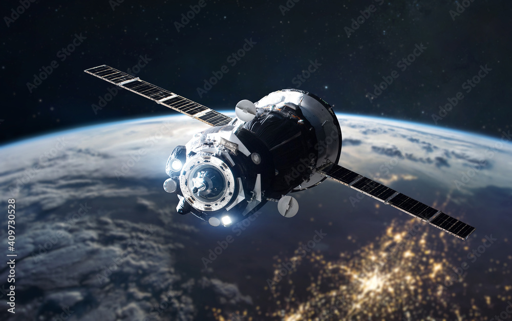 Spaceship over Earth in outer space. Solar system. City lights at night ...