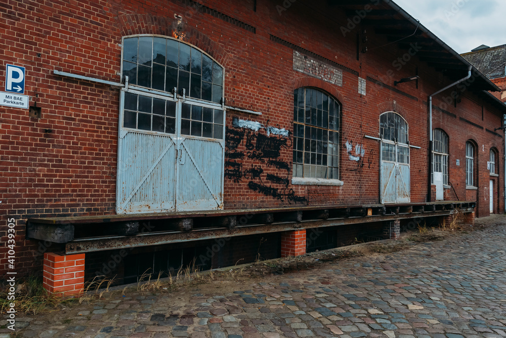 The loading ramp of an old warehouse, loading ramp and a sliding gate ...