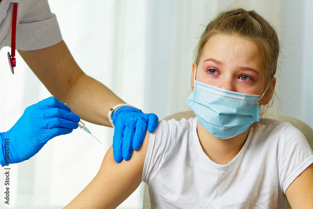 girl is crying afraid of the injection vaccination. Fear of injections ...