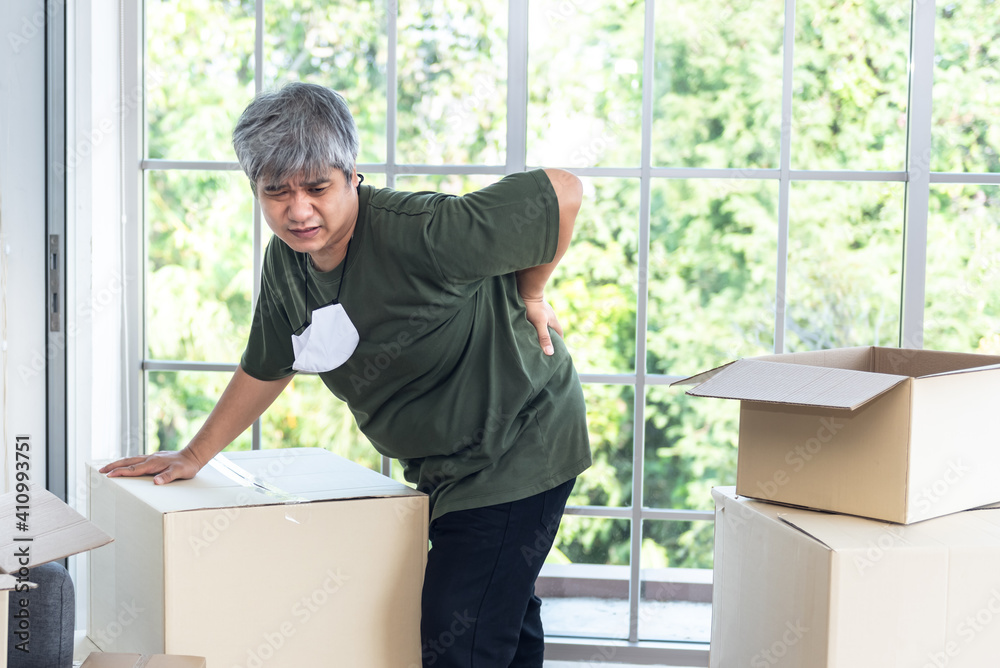 Obese middle aged Asian man, having back muscles pain Because of ...
