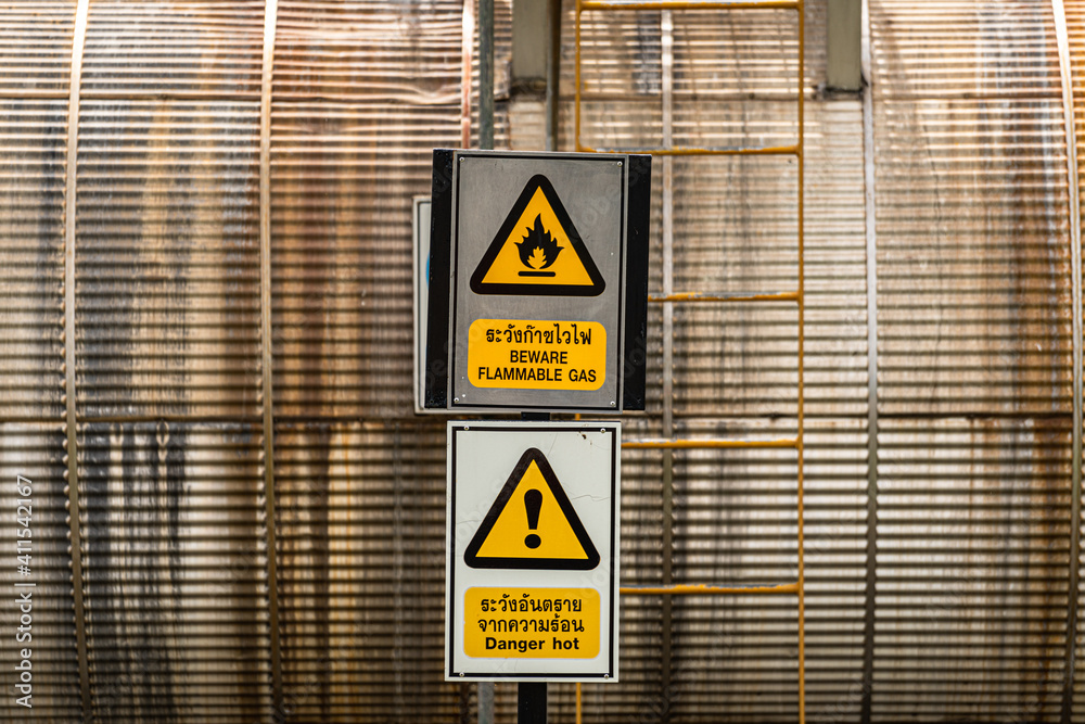 Warning sign plate (English and Thai text) which is located in the high ...
