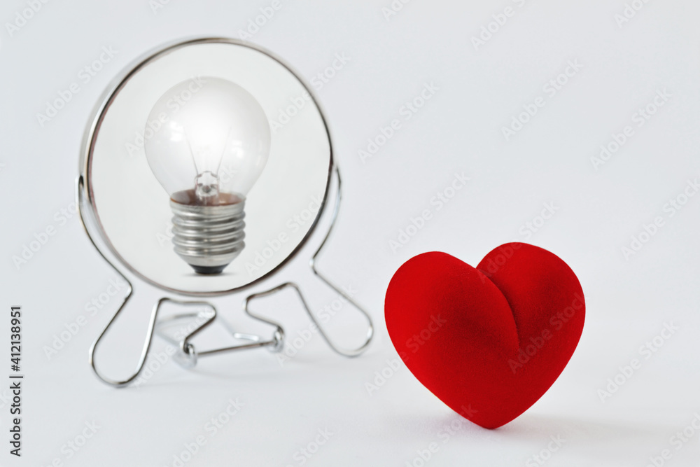 Heart looking in the mirror and seeing itself as a light bulb - Concept ...