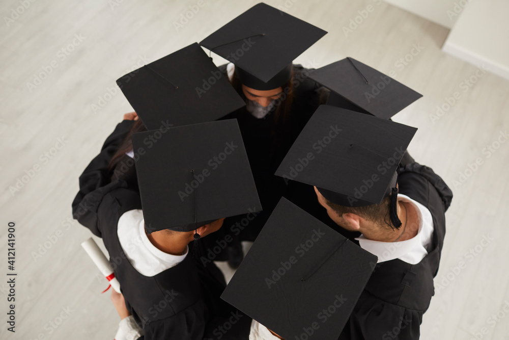 Foto Education, power, unity and bonding. Students in black caps and ...