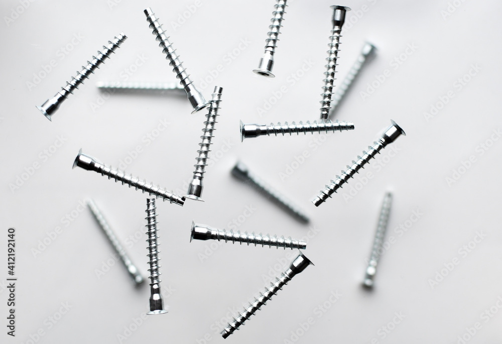 Collection of screw heads. Background of screws and dowels. Levitation ...