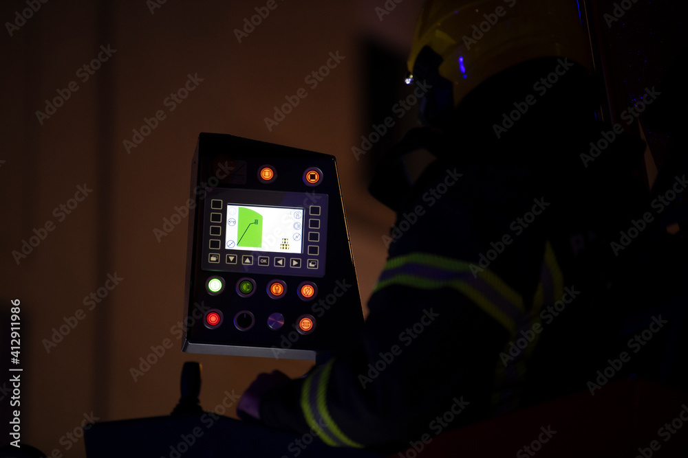 Firefighters control hydraulic firefighting basket. Control panel ...