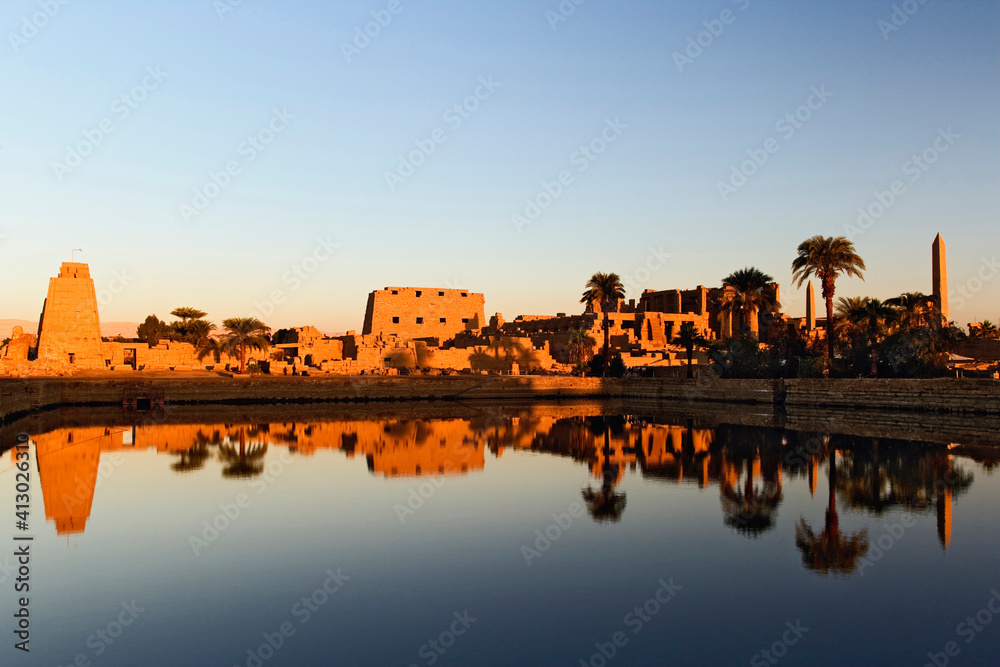 Karnak Temple and the Sacred Lake at sunrise. Karnak was the residence ...