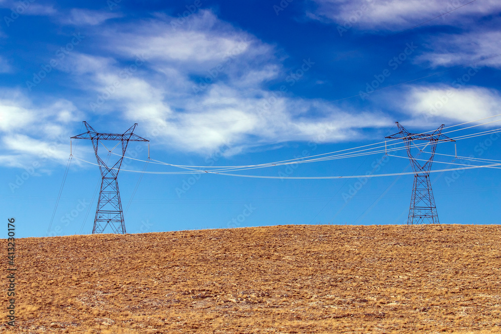 High voltage electric pole and transmission lines. High voltage grid ...