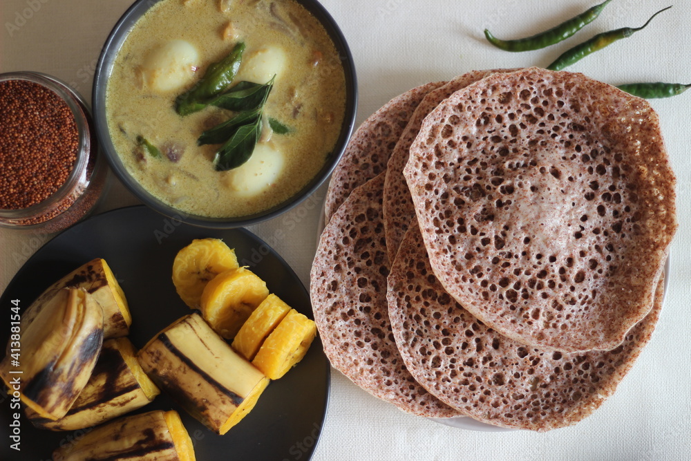 Foto de Stock Hoppers made of finger millet served with egg stew ...