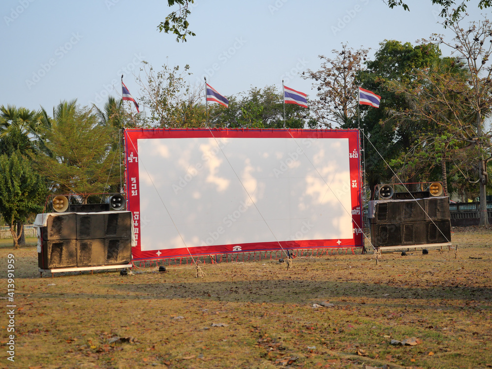 Outdoor movie screen with Thai characters mean Wealthy and Have a good ...