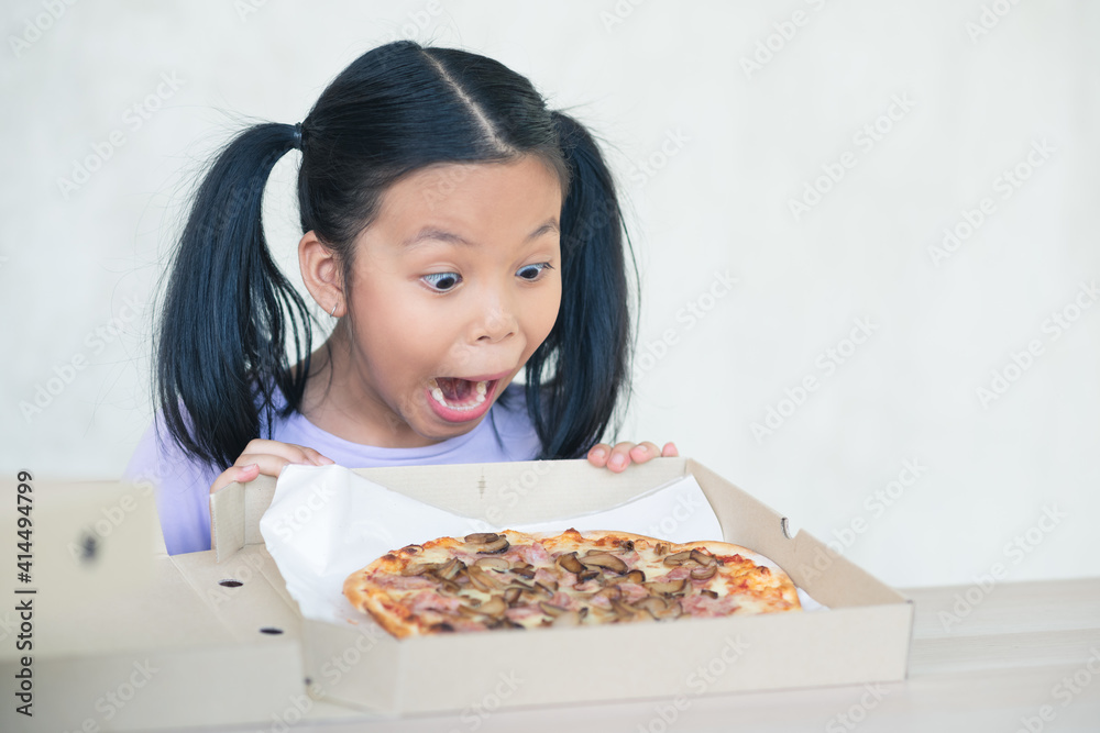 Asian children girl surprised with pizza, surprised with very nice ...