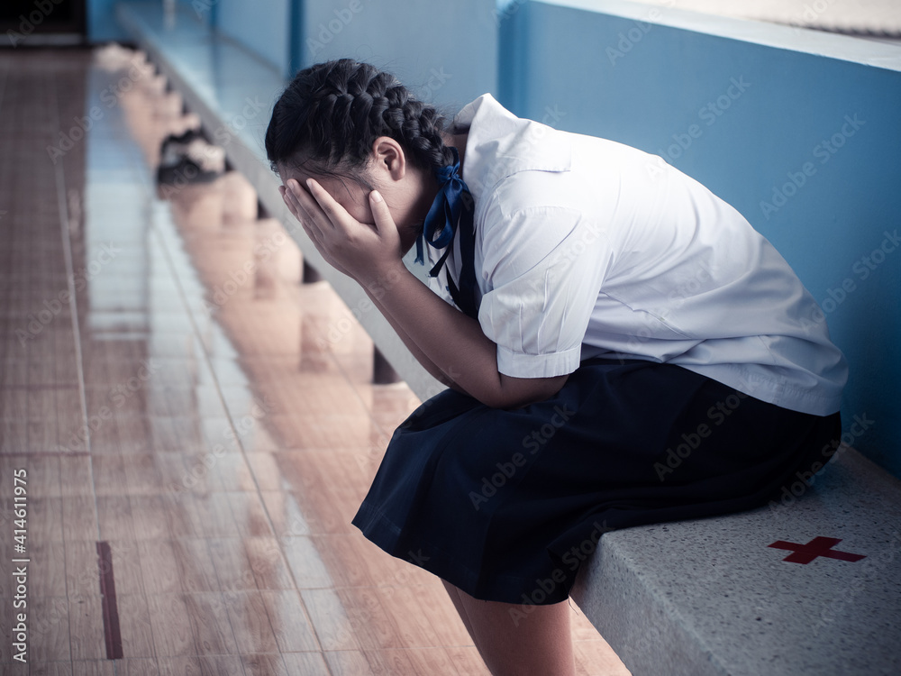 Asian young girl student sitting alone with sad feeling at school Stock ...