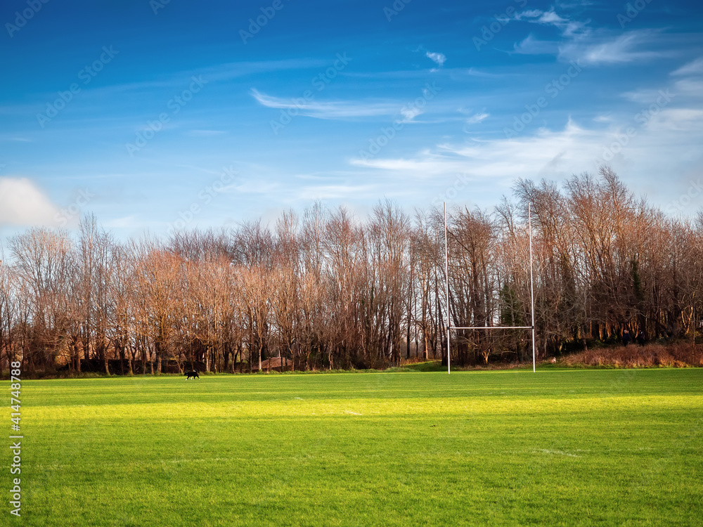 Training ground for Irish National sports with tall goal posts. Blue ...