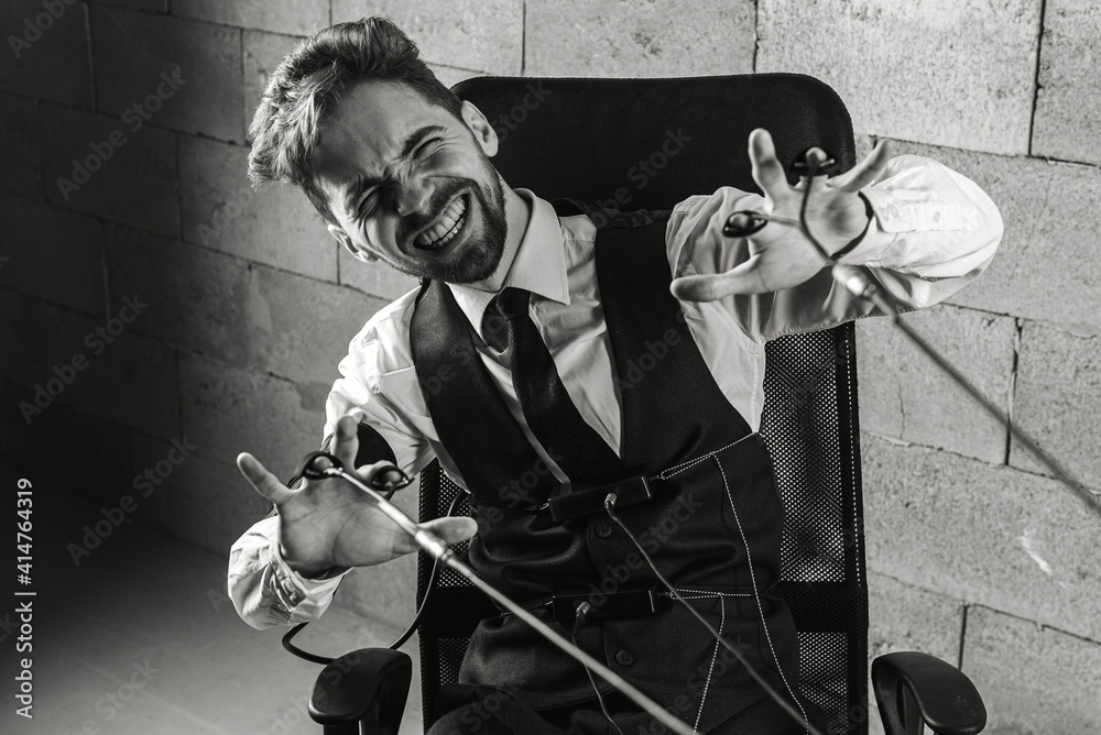 black and white, frightened, worried, man sitting on chair, testing on ...