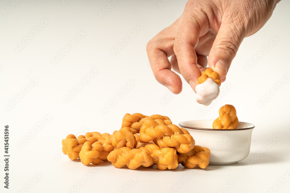 Traditional Chinese snack honey mahua on a solid color background Stock ...