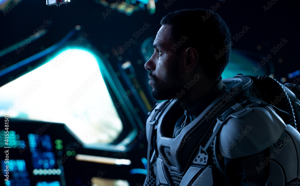 Portrait of African American Black male astronaut inside spaceship ...