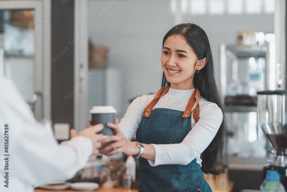 Barista smile pretty. Coffee shop owner Asian Happy serving at the ...