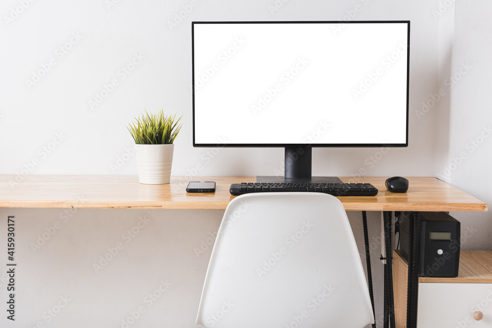 Computer monitor with white blank screen on the business desk with ...