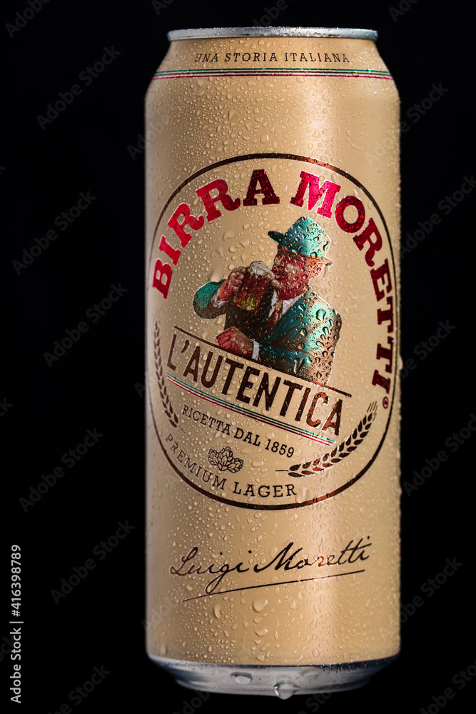 Birra Moretti, a premium lager beer with water droplets on black ...