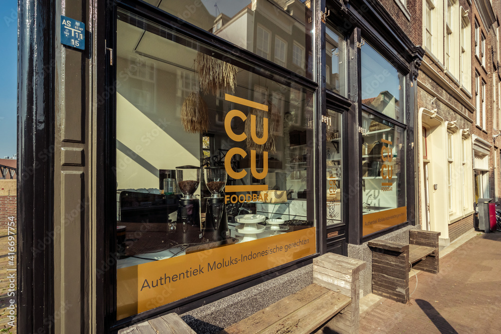 Logo on a window of restaurant Het Magazijn. Magazijn is one of a ...