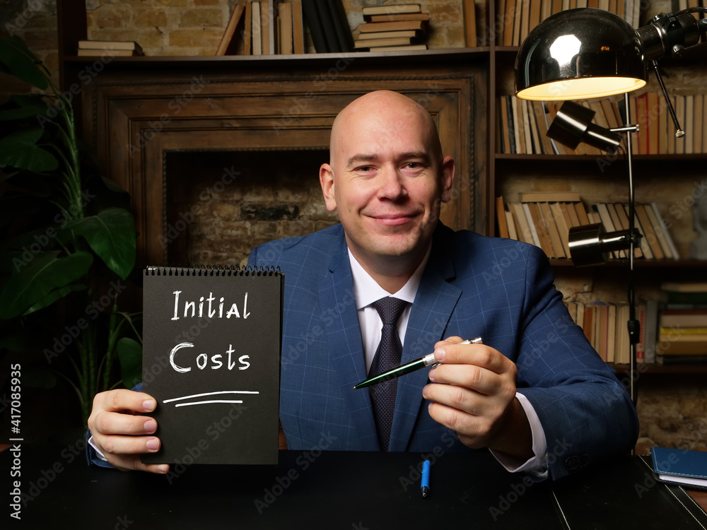 Man wearing blue business suit and showing black notepad with written ...