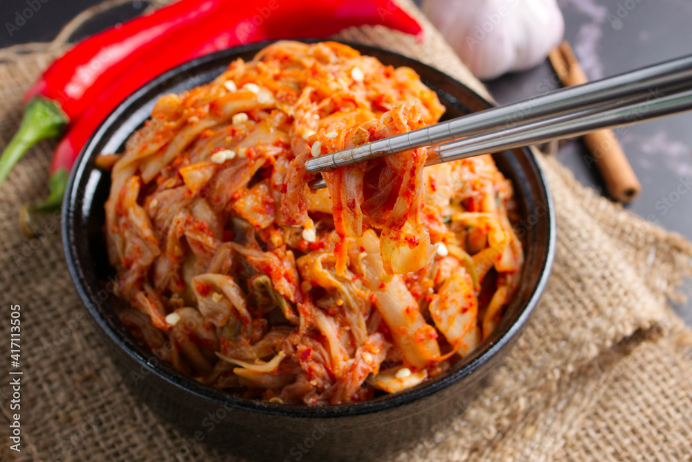 Korean food, Cabbage kimchi in black dish set on dark background. Stock ...
