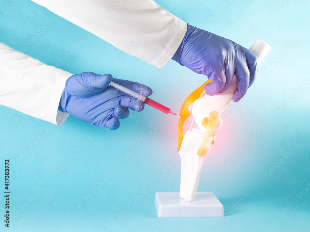 Foto de Stock The doctor injects the patient's blood plasma into the ...