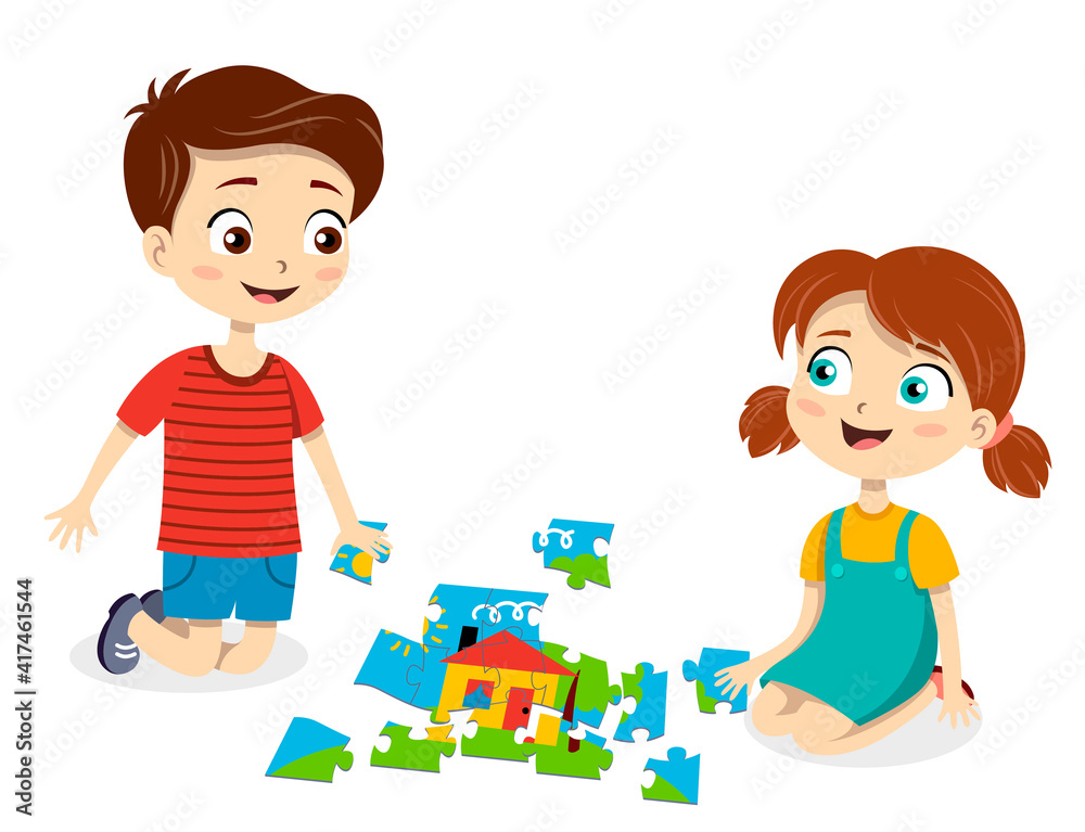 Young boy and girl having fun doing a jigsaw puzzle together laughing ...