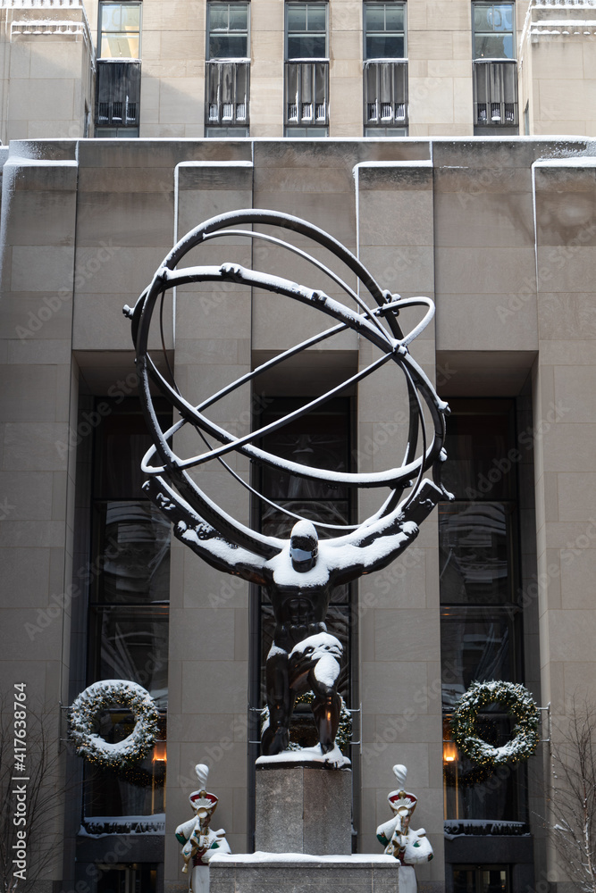 Atlas Statue at Rockefeller Center covered in Snow and Wearing a Mask ...